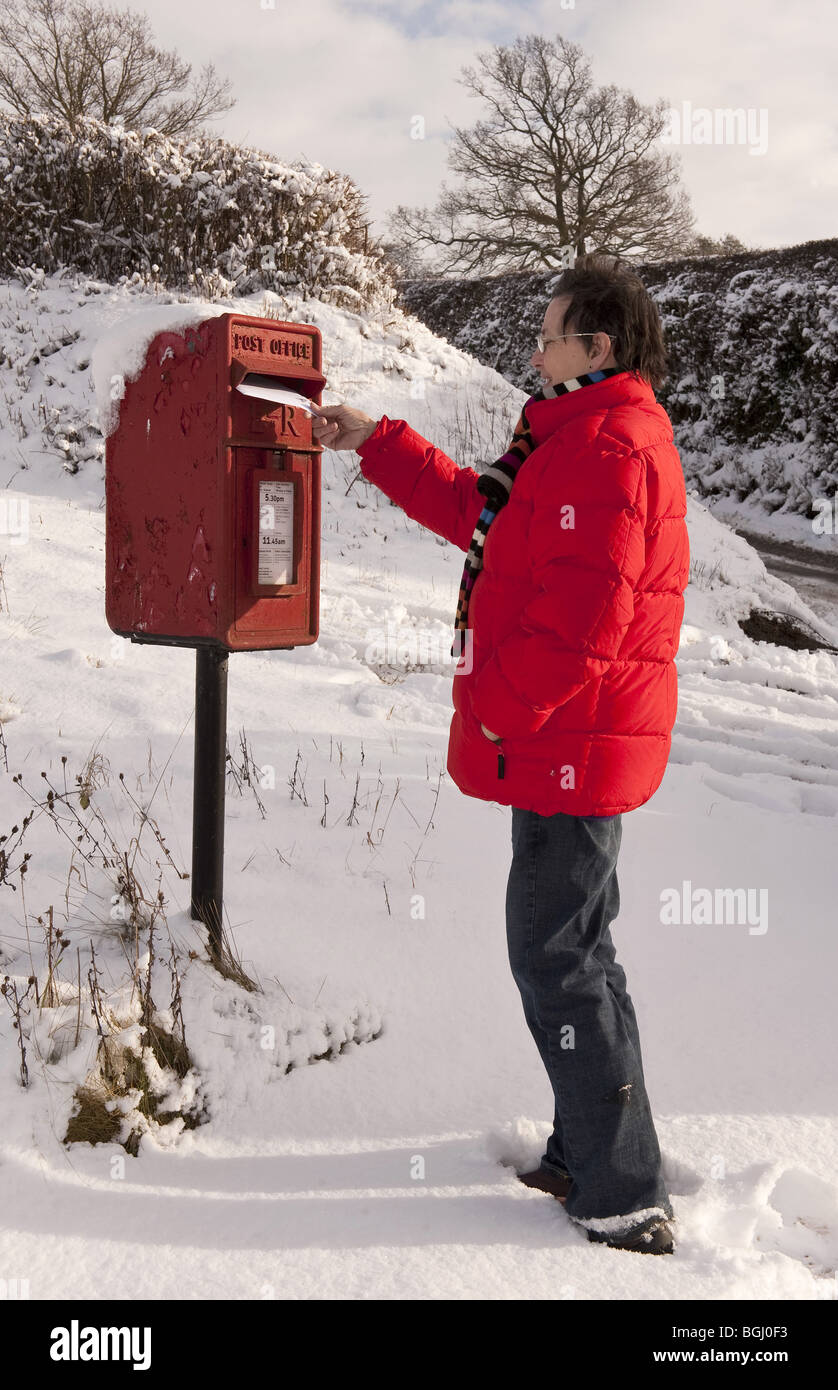 Woman posting letter in post hi-res stock photography and images - Alamy