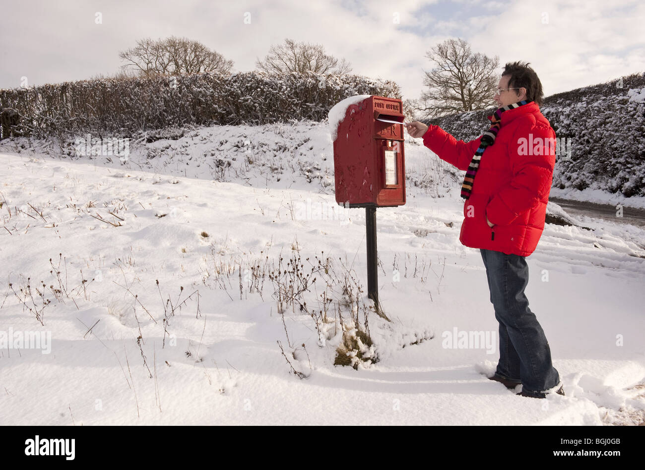 Woman posting letter in post hi-res stock photography and images - Alamy