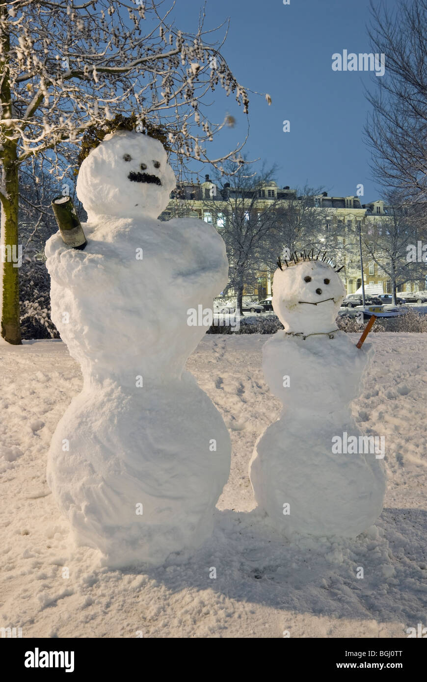Two snowmen standing side by side in a park in Amsterdam Stock Photo ...