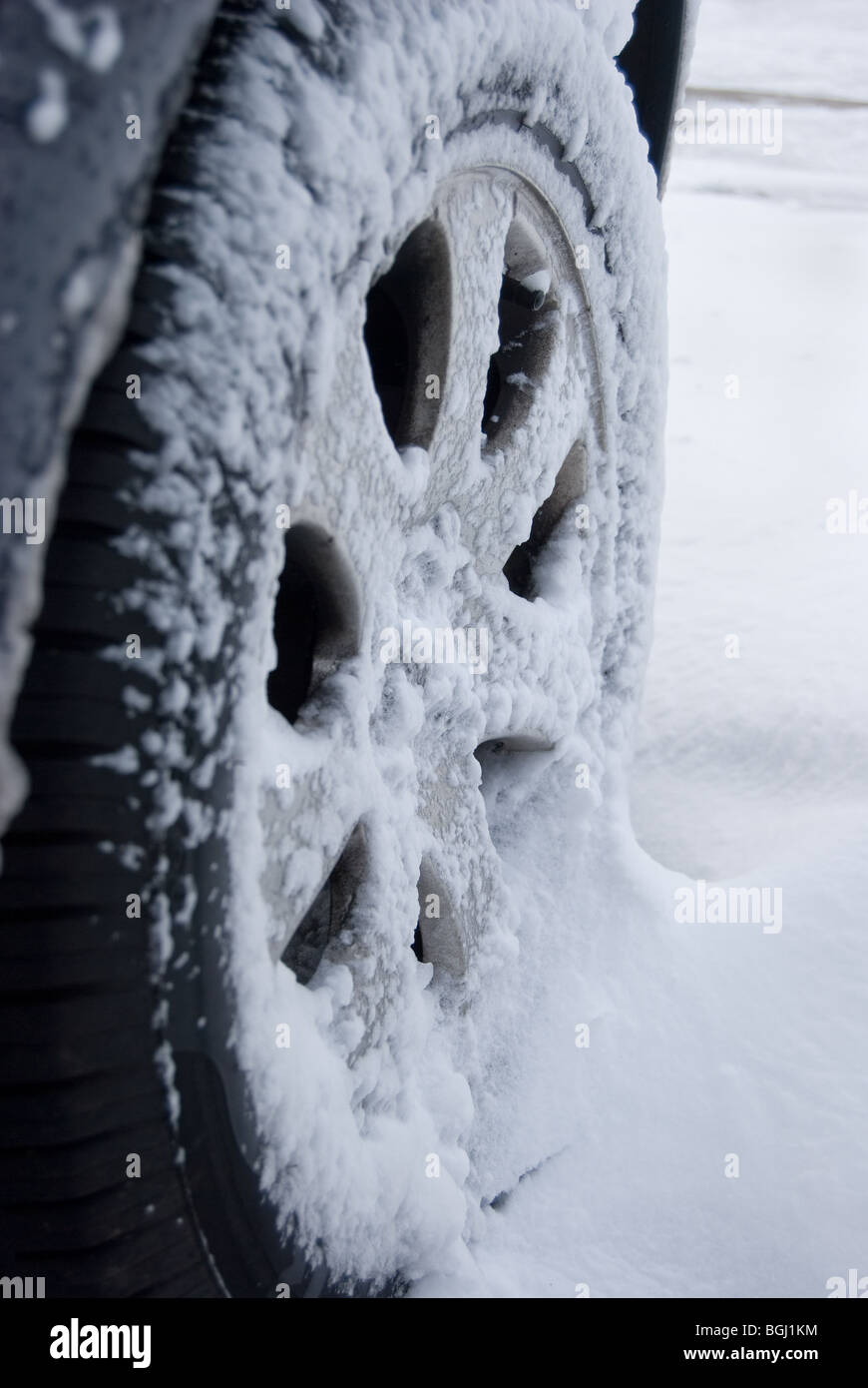 Car wheel covered in snow Stock Photo - Alamy