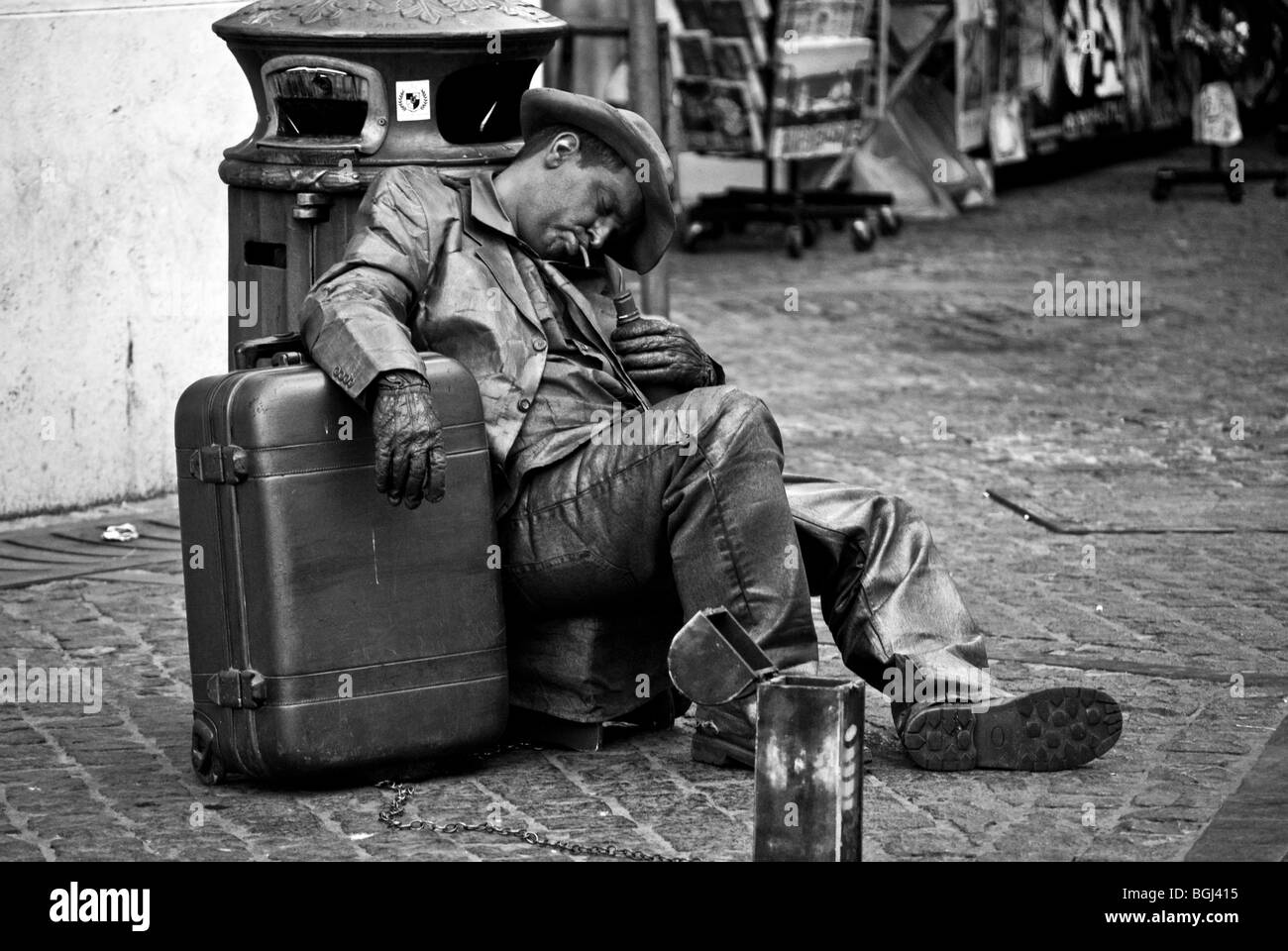 A mime pretending to be drunk and exhausted in Piazza Navona, Rome ...