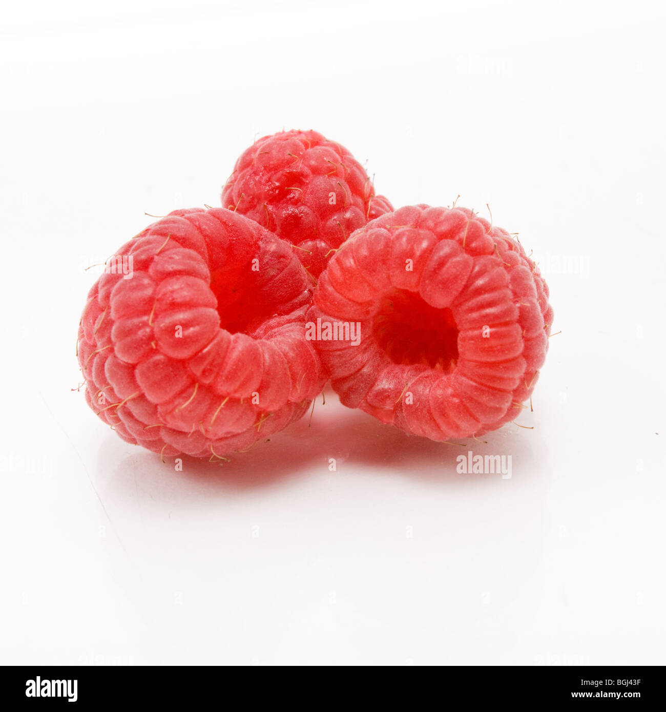 Red vibrant Raspberries isolated against white background Stock Photo ...