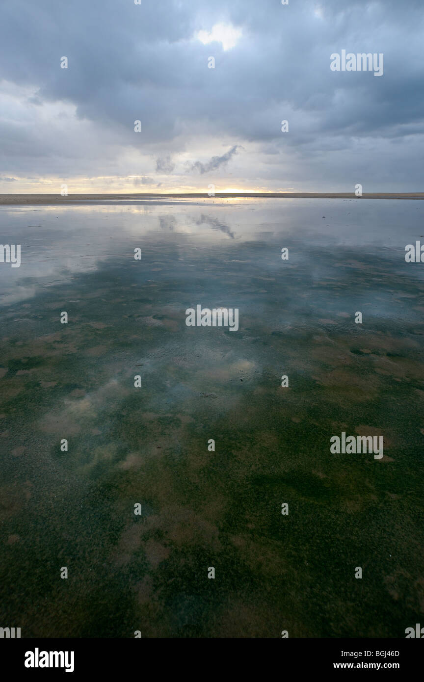 Cloudscape reflection in the shallow estuary waters at St Lucia ...