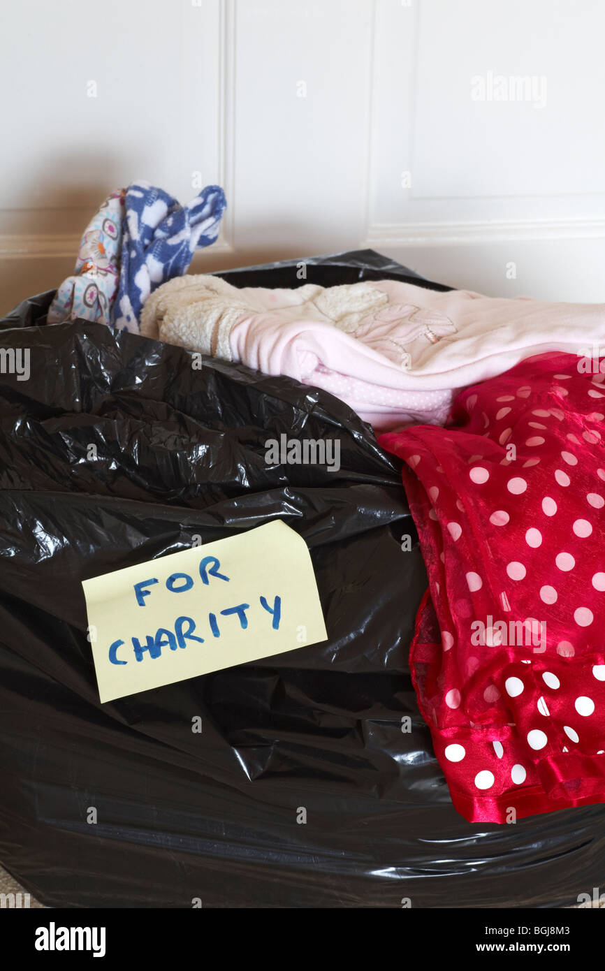 black bag of clothes destined for charity shop Stock Photo - Alamy