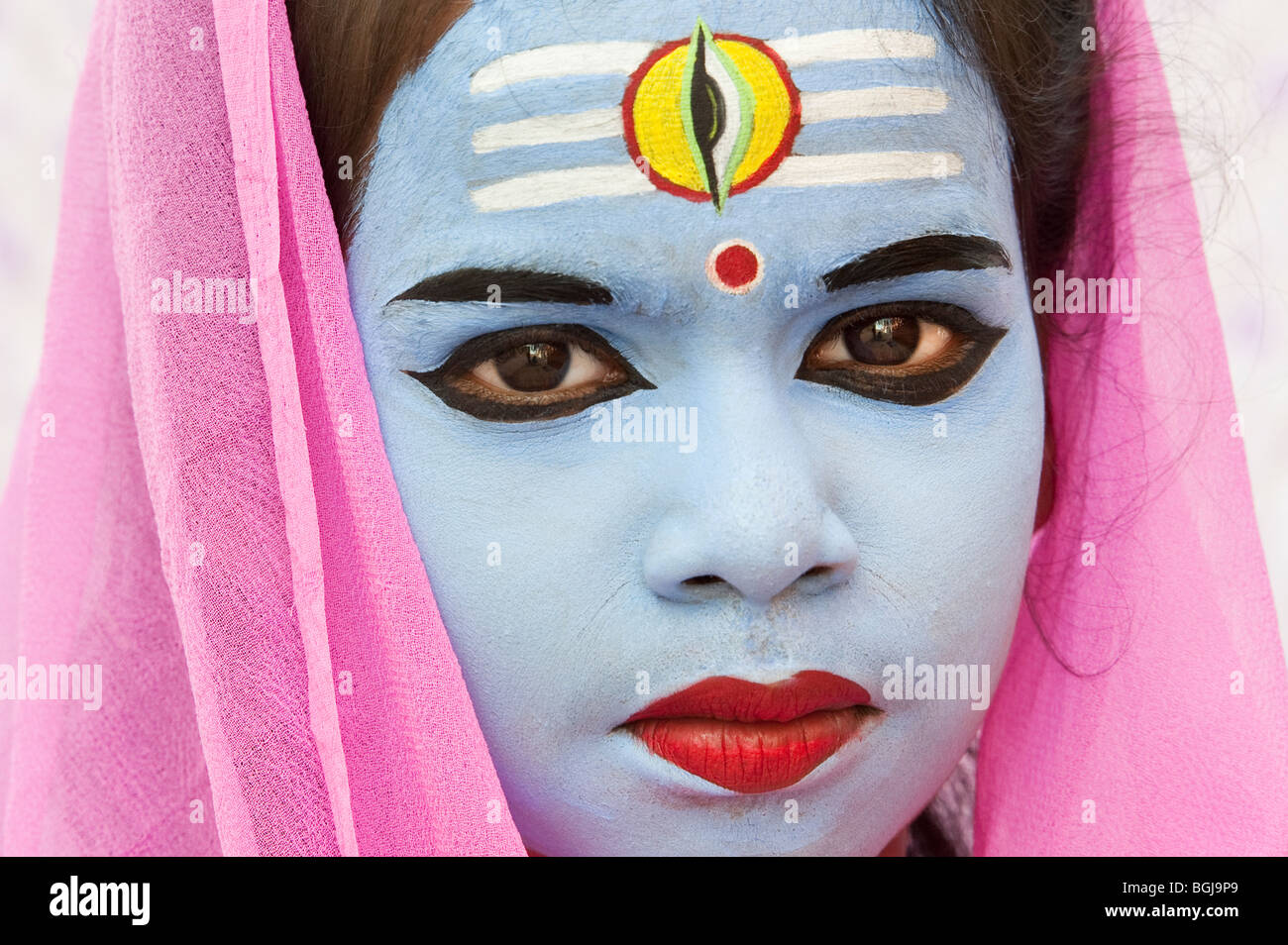 Indian girl with face painted as the Hindu god Shiva. India Stock Photo ...