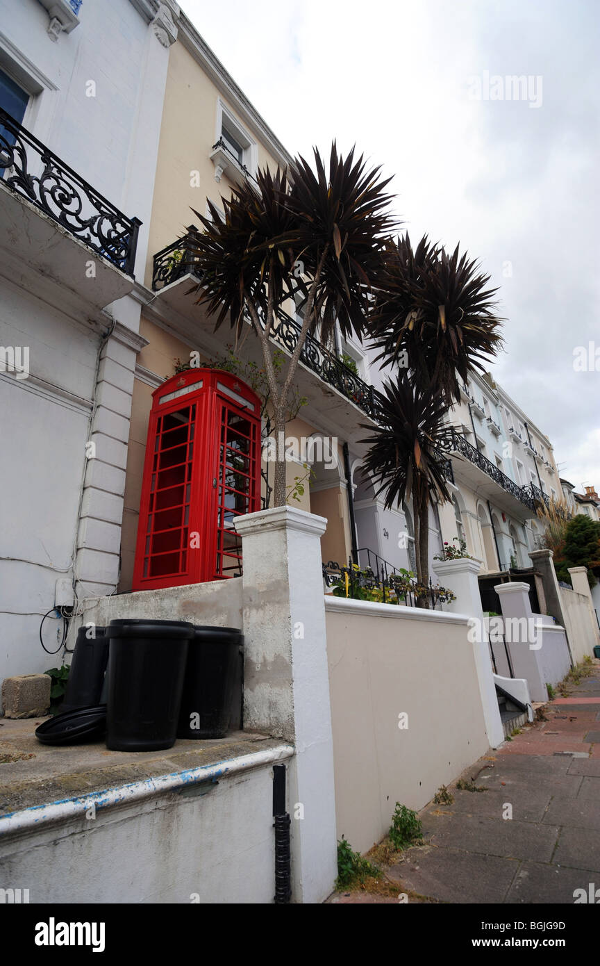 A red phone box in the front garden of a house in brighton Stock Photo ...