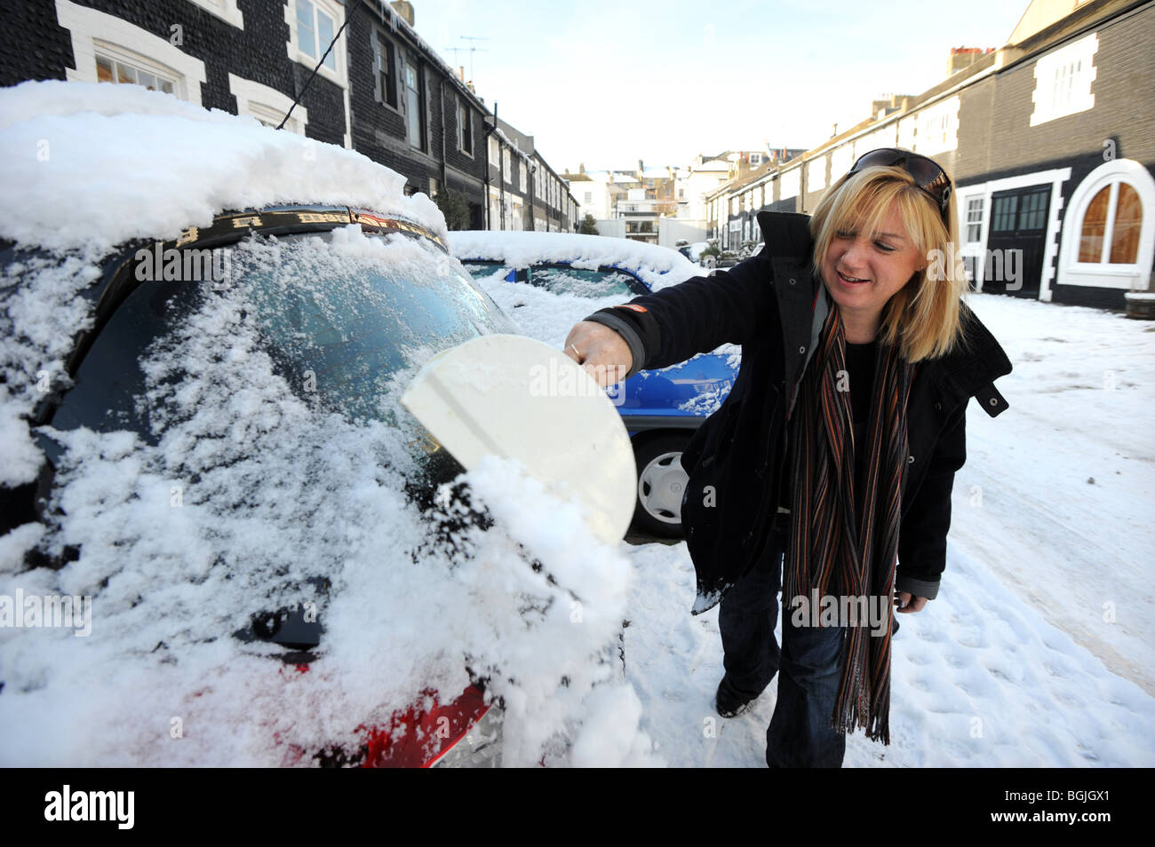 Clearing snow off car hi-res stock photography and images - Alamy