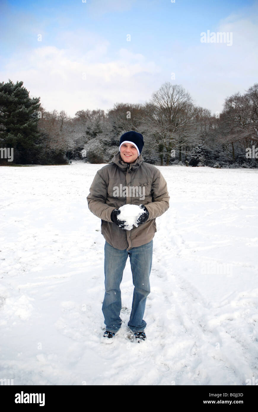 Man having a snowball fight Stock Photo - Alamy