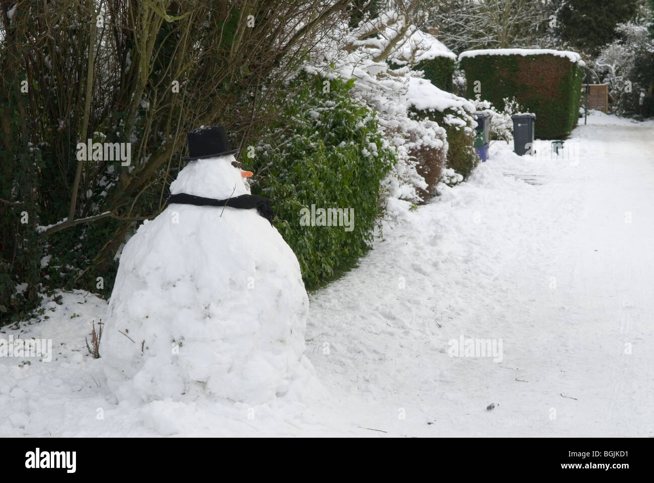 Winter weather 2010, snowmen in suburban road, housing, heavy snow fall ...