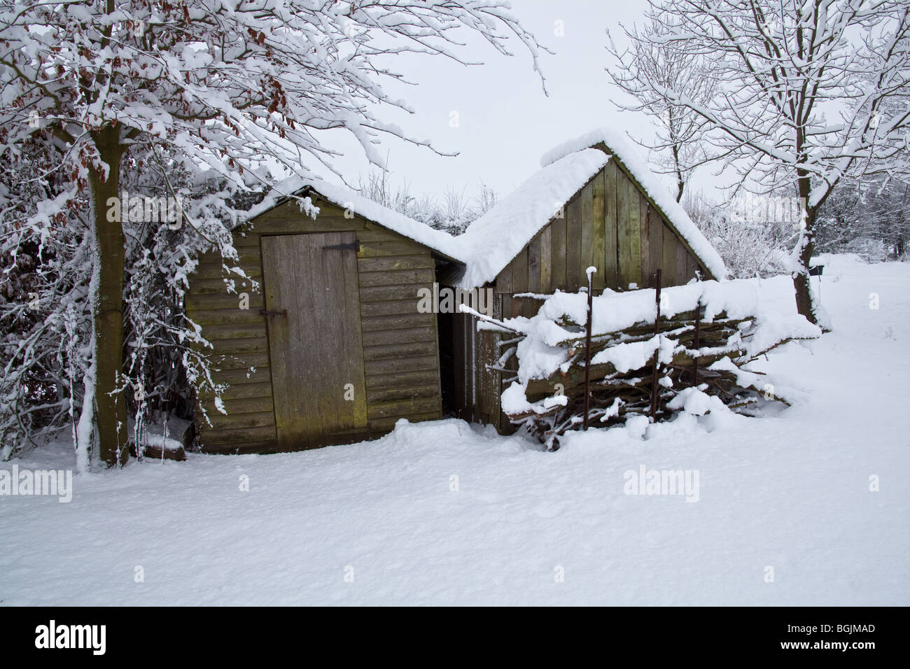 Snow covered wooden garden sheds, Hampshire , England Stock Photo - Alamy