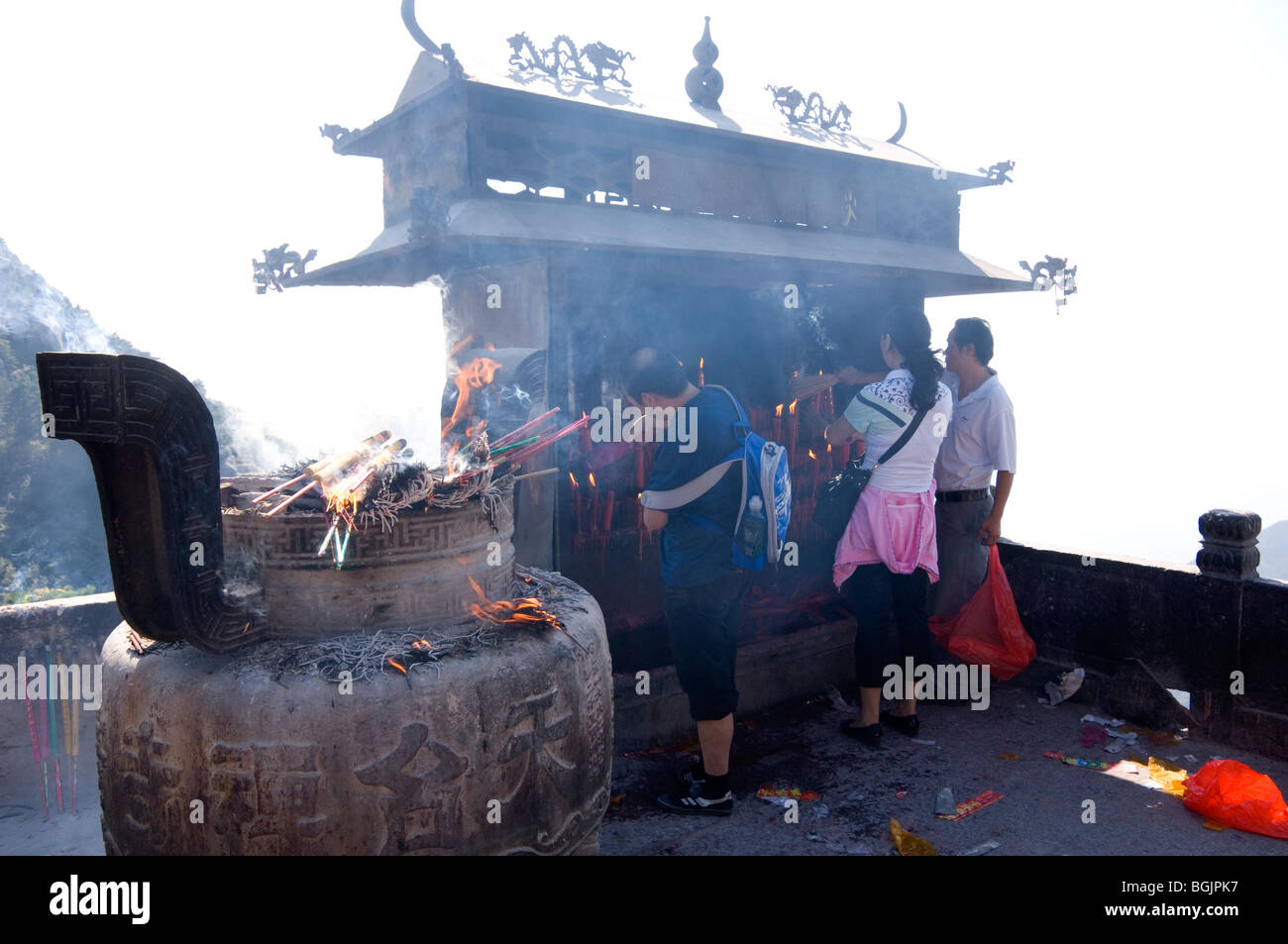 Worshipers burning incense at Tiantai Temple, or Ksitigarbha Buddhist ...