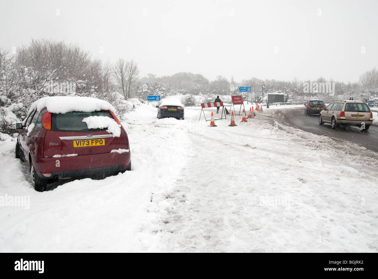 Abandoded vehicles and road closed signs. Major snow fall A3 area of ...