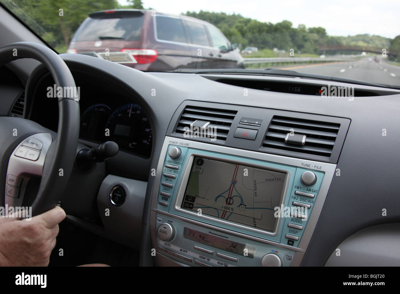 Driver uses car GPS system to navigate the roadways Stock Photo - Alamy