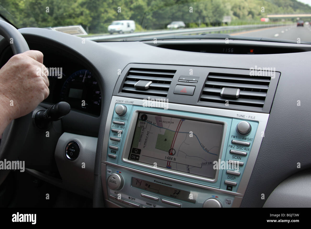 Driver uses car GPS system to navigate the roadways Stock Photo - Alamy