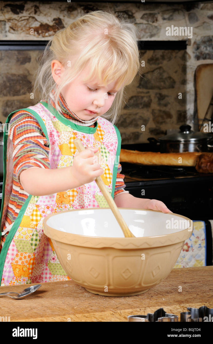 Child stirring wooden spoon hi-res stock photography and images - Alamy