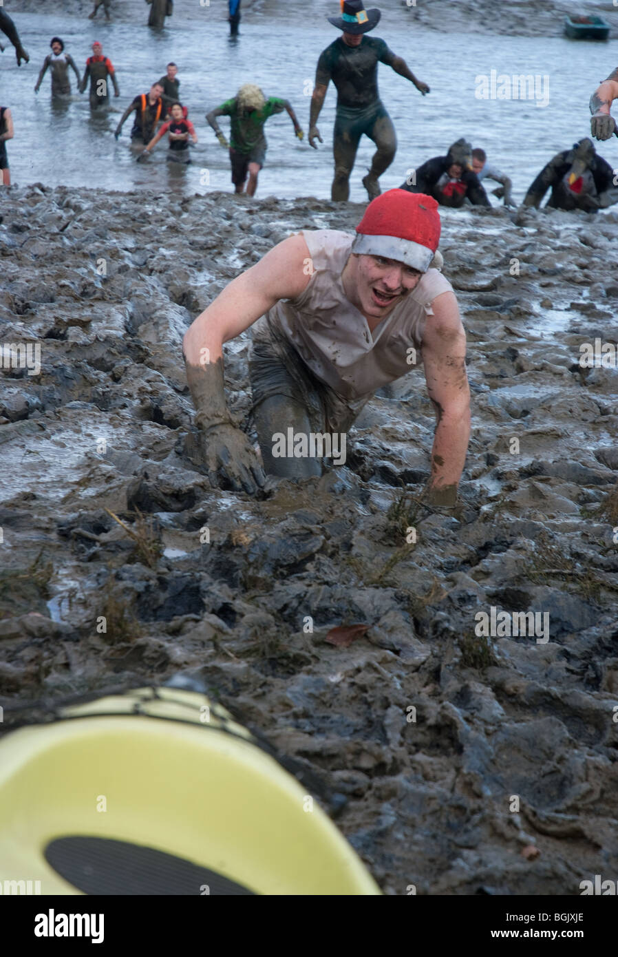 a competitor struggles through the mud during the 2009 maldon mud race ...