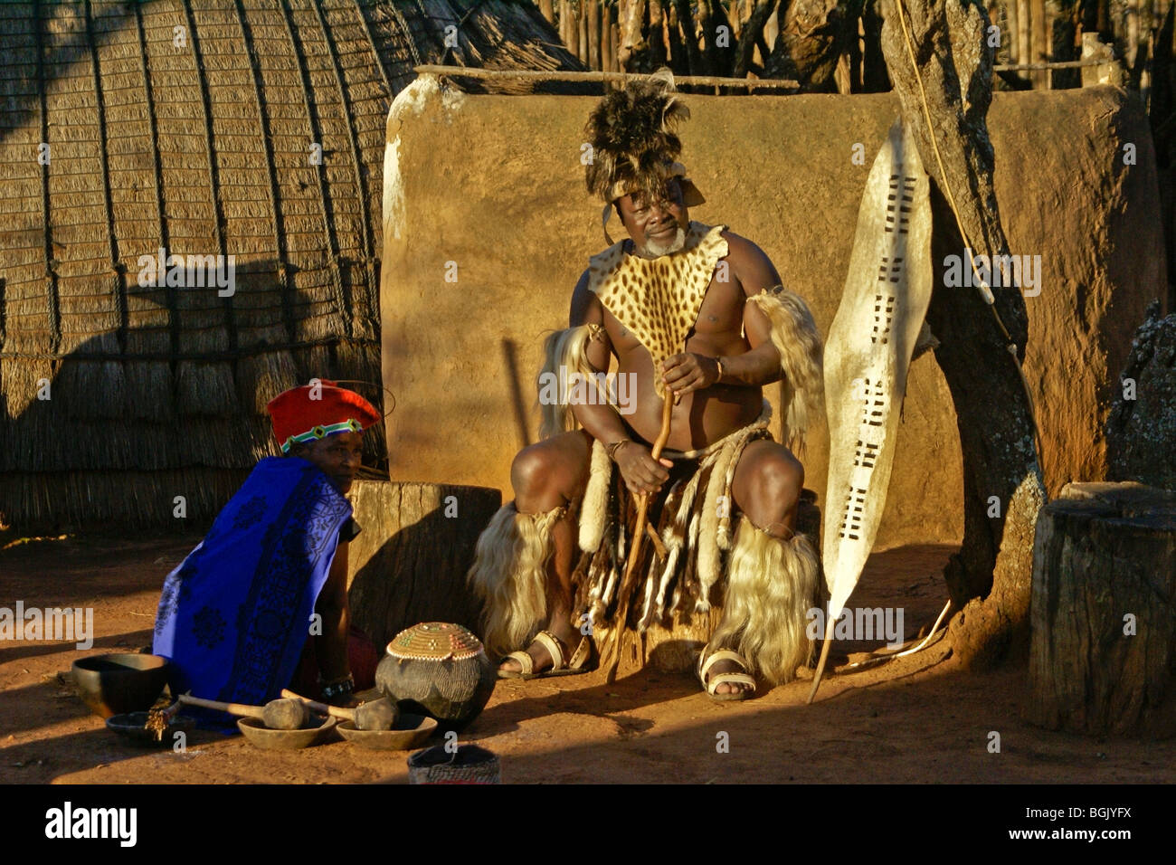 Zulu chief and woman in village compound, Shakaland, South Africa Stock ...