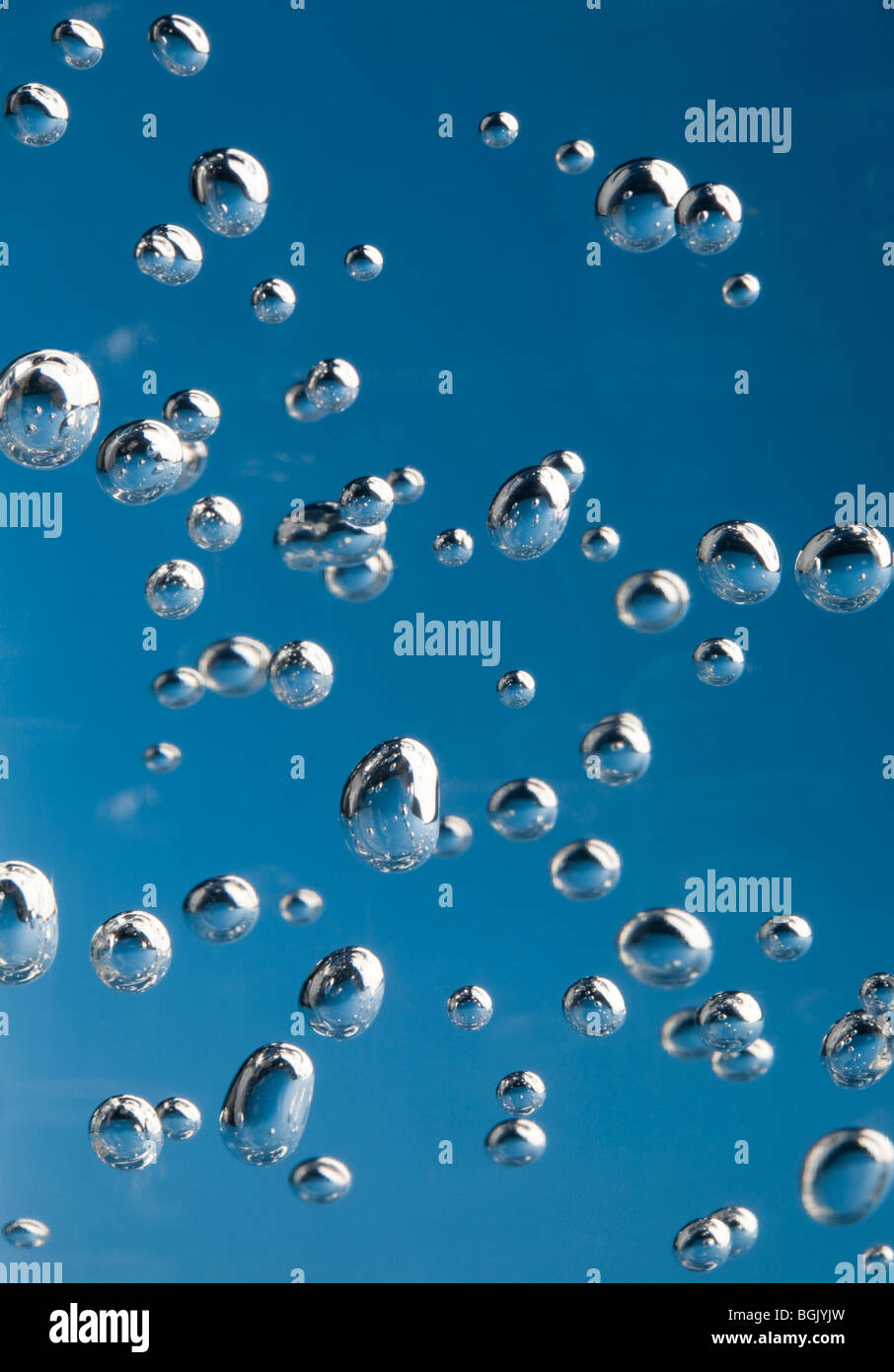 Bubbles with a blue background Stock Photo - Alamy