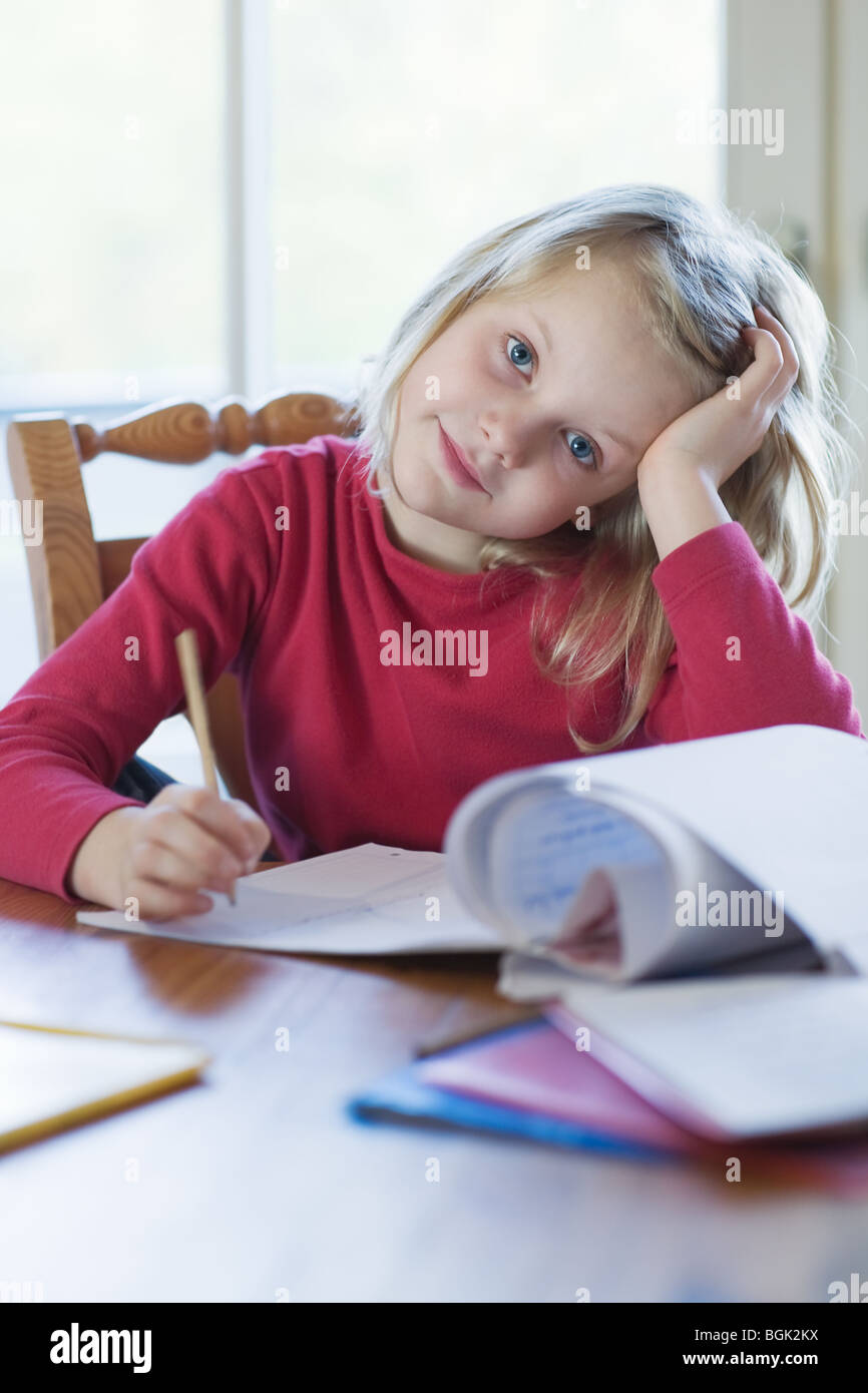 Young school girl doing homework Stock Photo - Alamy
