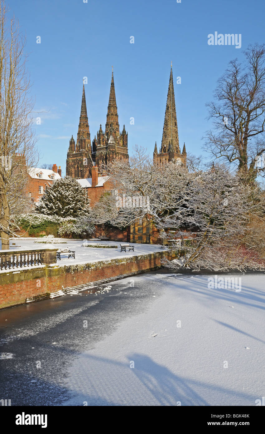 Three spires Cathedral Garden of Remembrance and Minster Pool on snowy ...