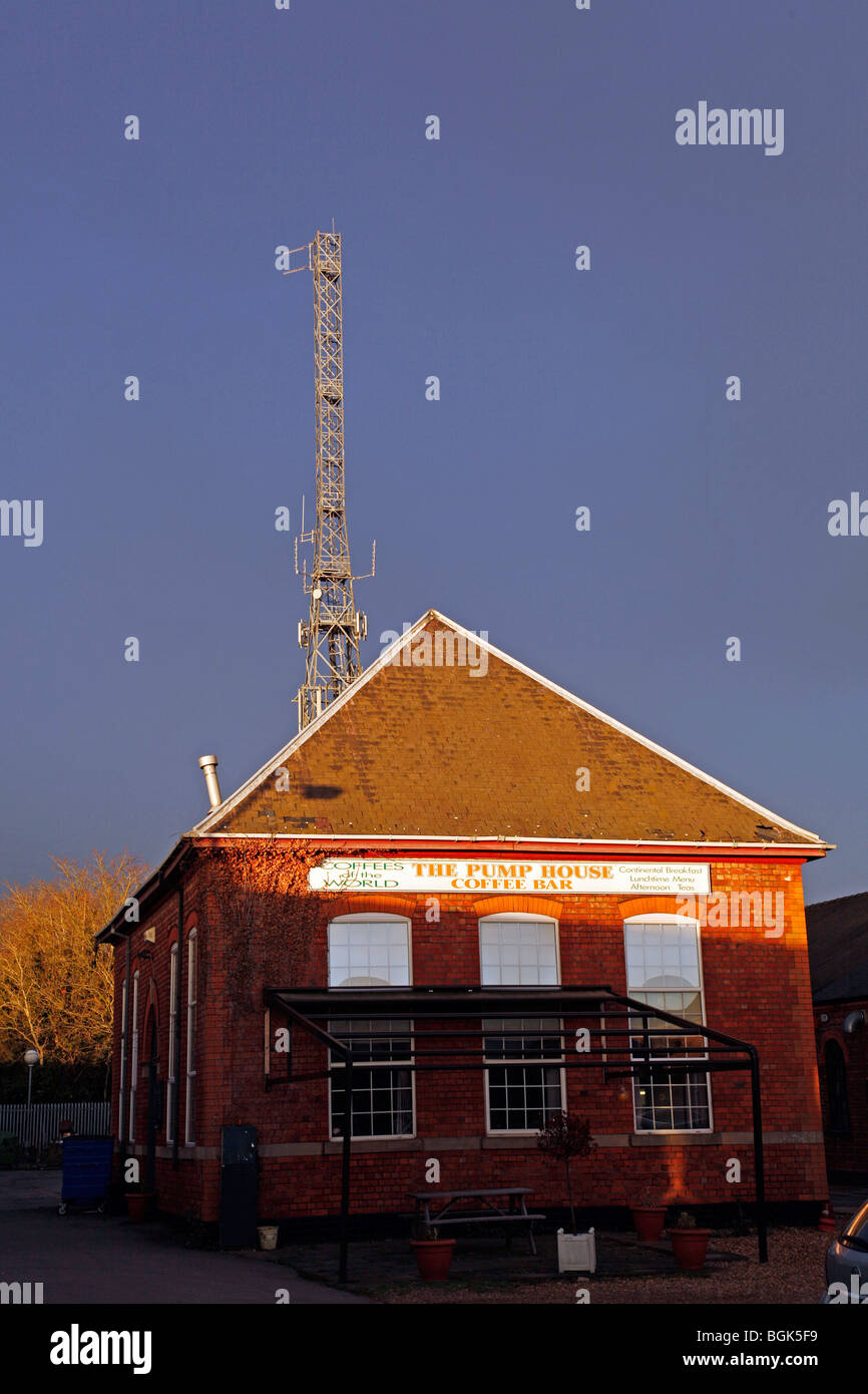 A telecommunications mast above a pointed roof Stock Photo - Alamy