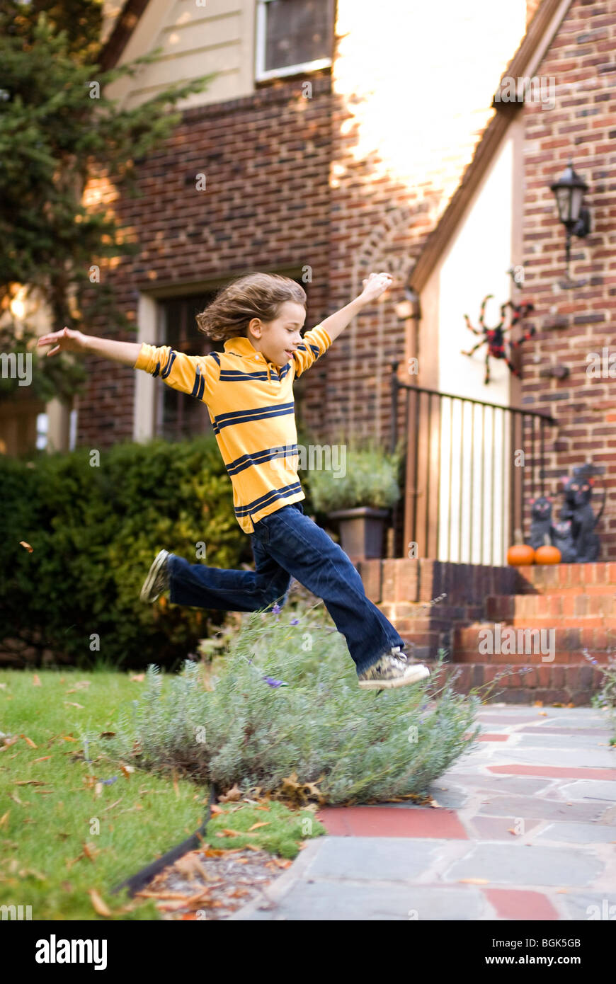 boy jumping in air Stock Photo - Alamy