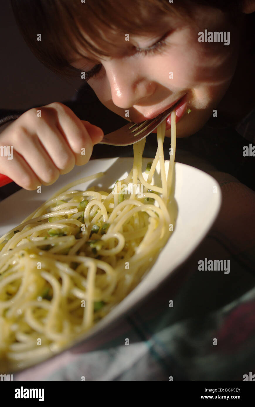 child eats pasta, spaghetti Stock Photo - Alamy