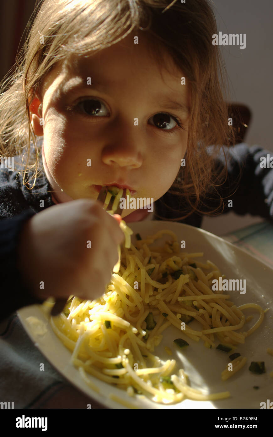 child eats pasta, spaghetti Stock Photo - Alamy