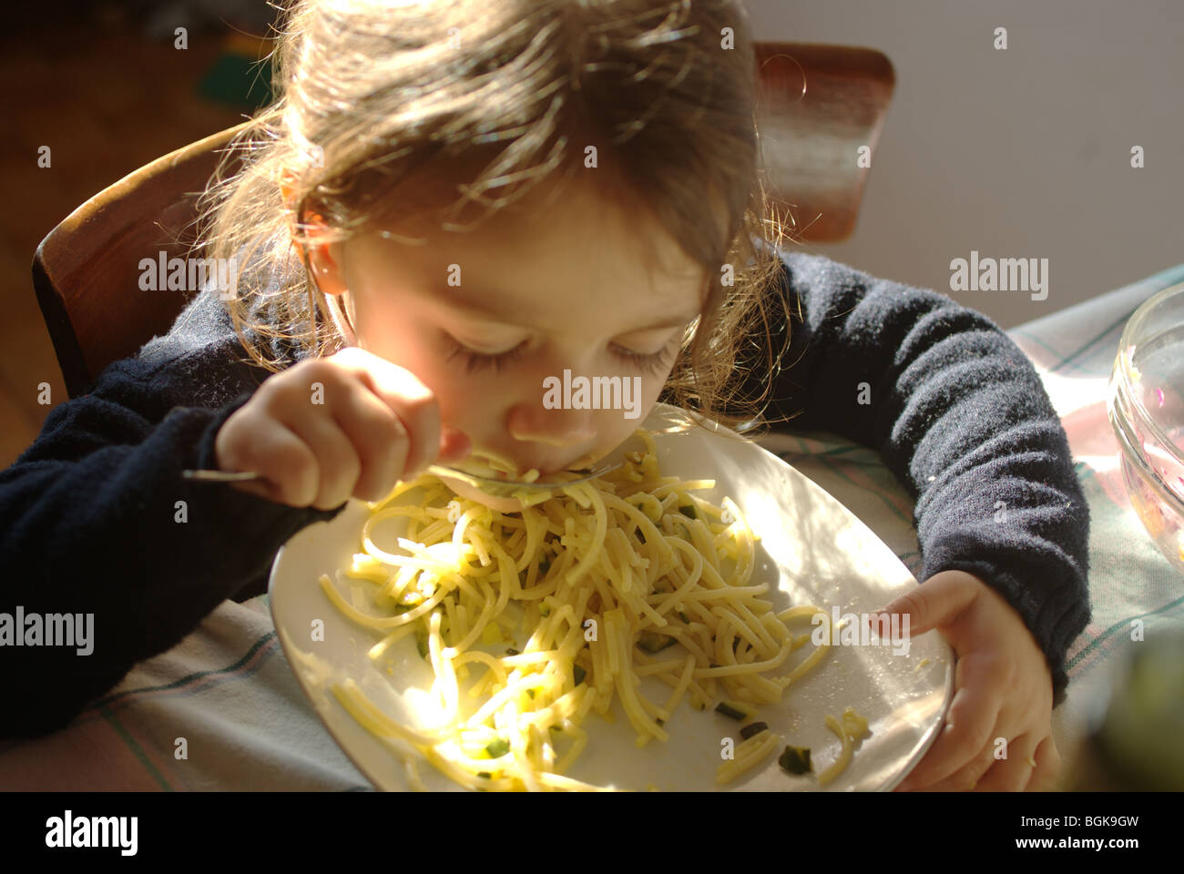 child eats pasta, spaghetti Stock Photo - Alamy
