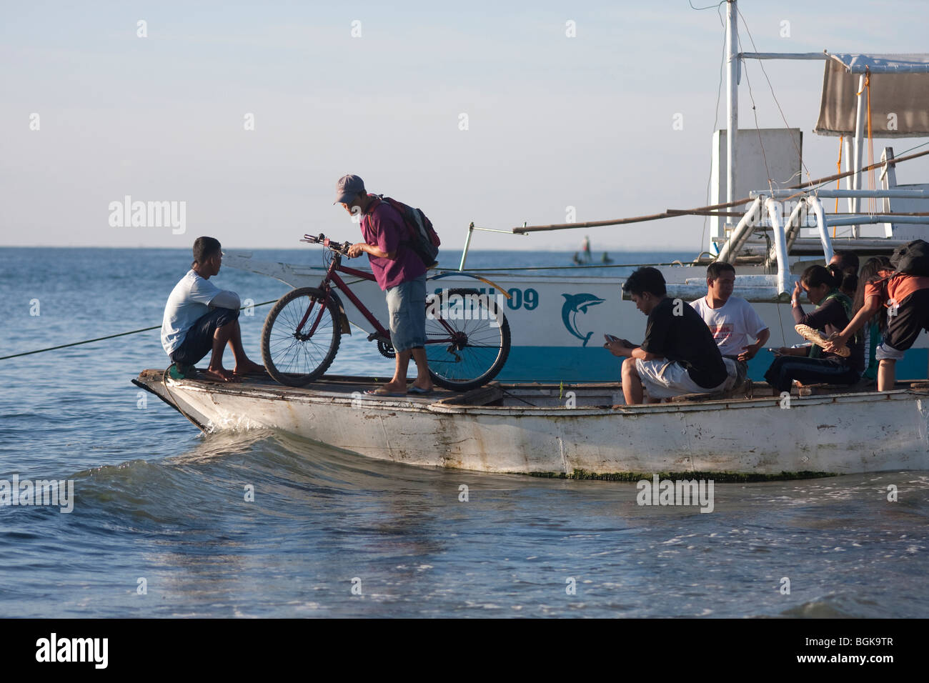 cyclist with bicycle on boat, mactan coast Philippines Stock Photo - Alamy
