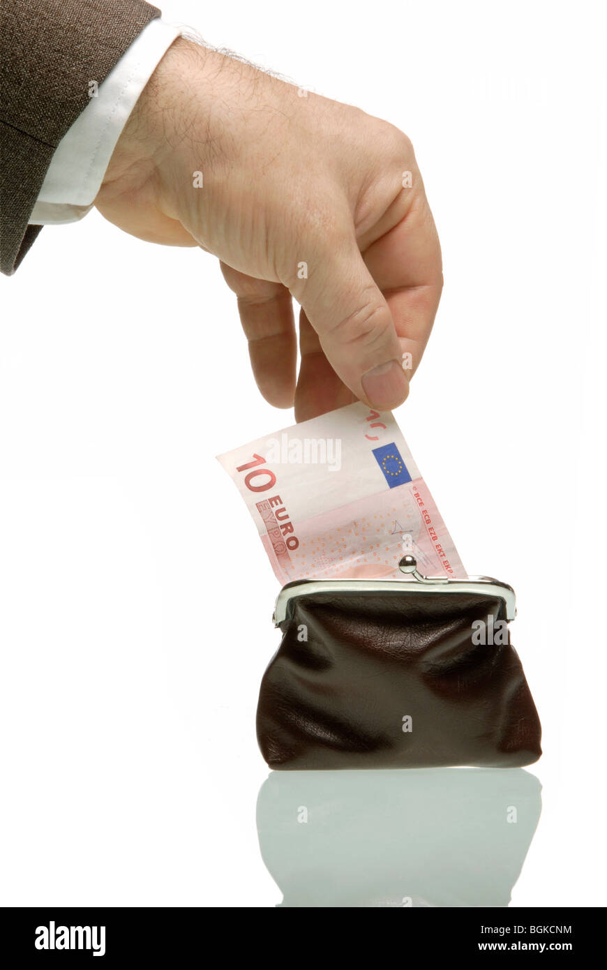 Business man pulling ten euro banknote from wallet, symbolic image for ...