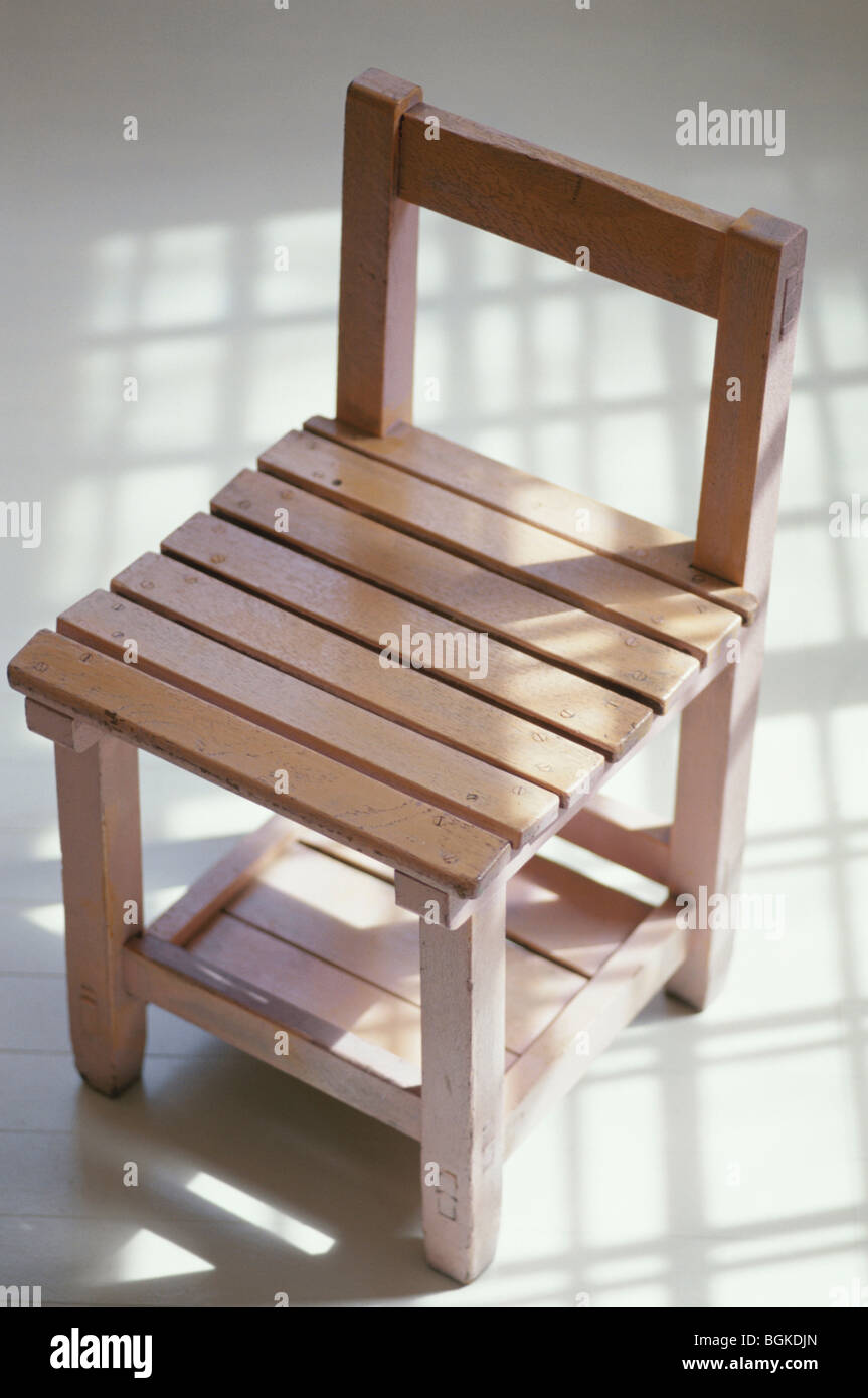 Wooden chair with shadow from window Stock Photo - Alamy