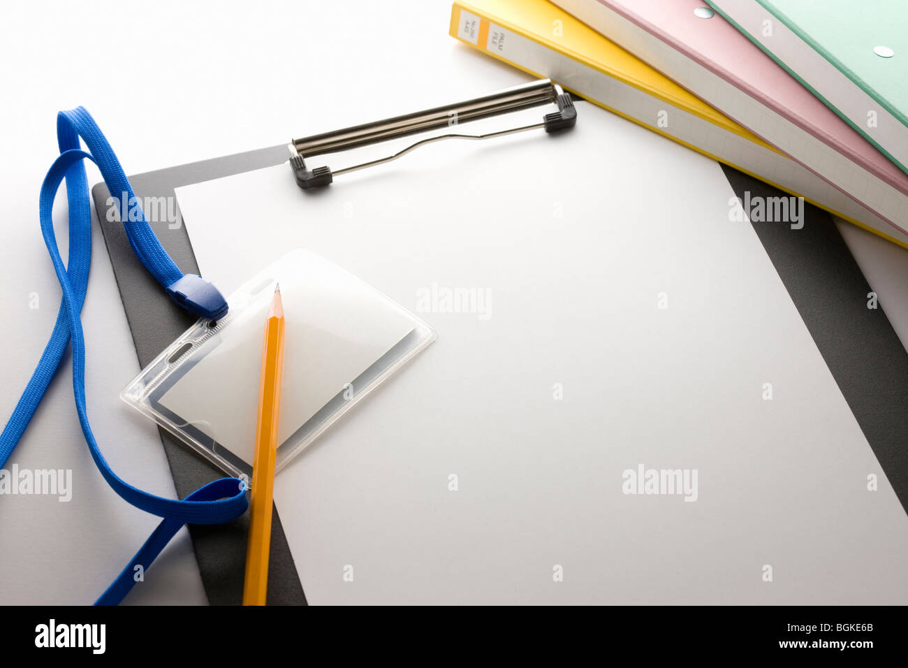Clipboard with ID tag, pencil and folders Stock Photo - Alamy