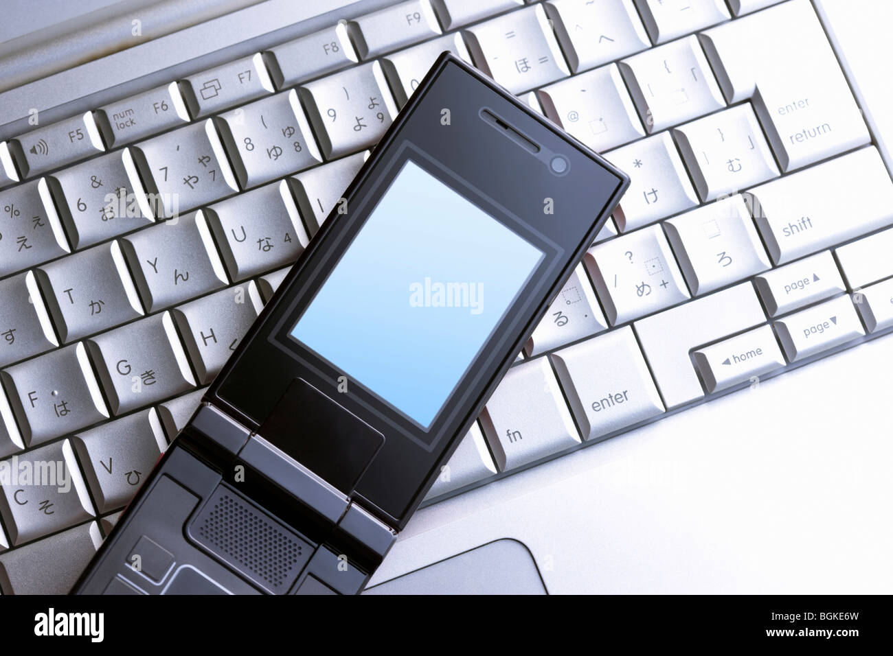Keyboard and mobile phone Stock Photo - Alamy
