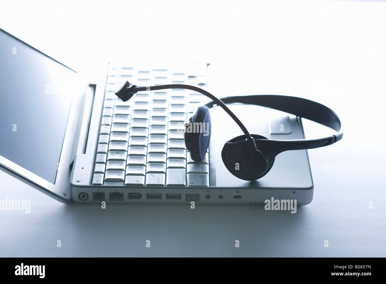 Headset and a laptop Stock Photo - Alamy