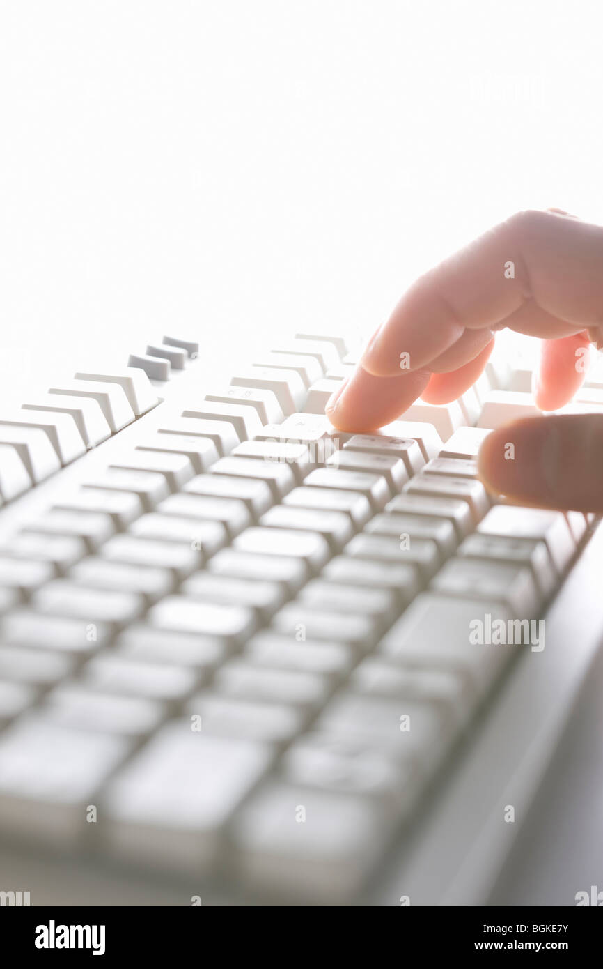 Person typing on keyboard Stock Photo - Alamy