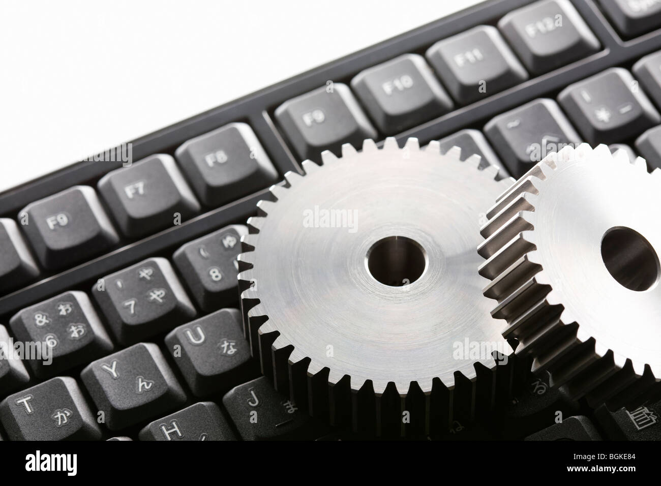Gears and computer keyboard Stock Photo - Alamy