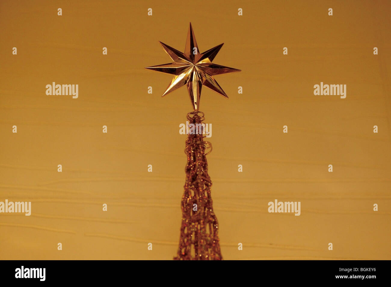 Golden star on Christmas tree Stock Photo - Alamy