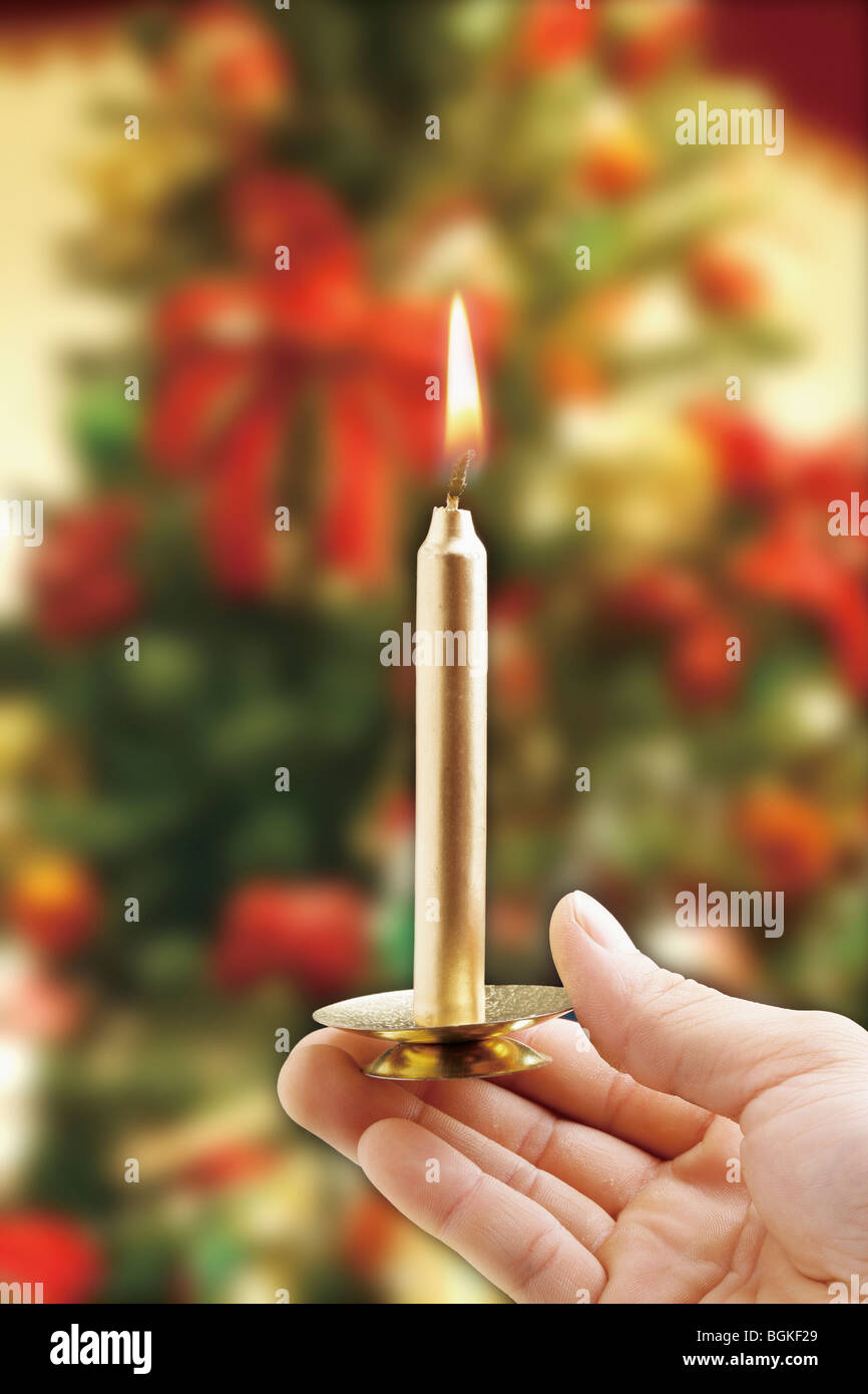 Person holding a candle Stock Photo - Alamy