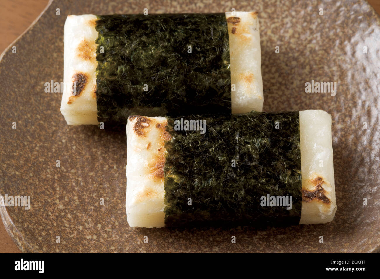 Two rice cakes with seaweed wrap Stock Photo - Alamy