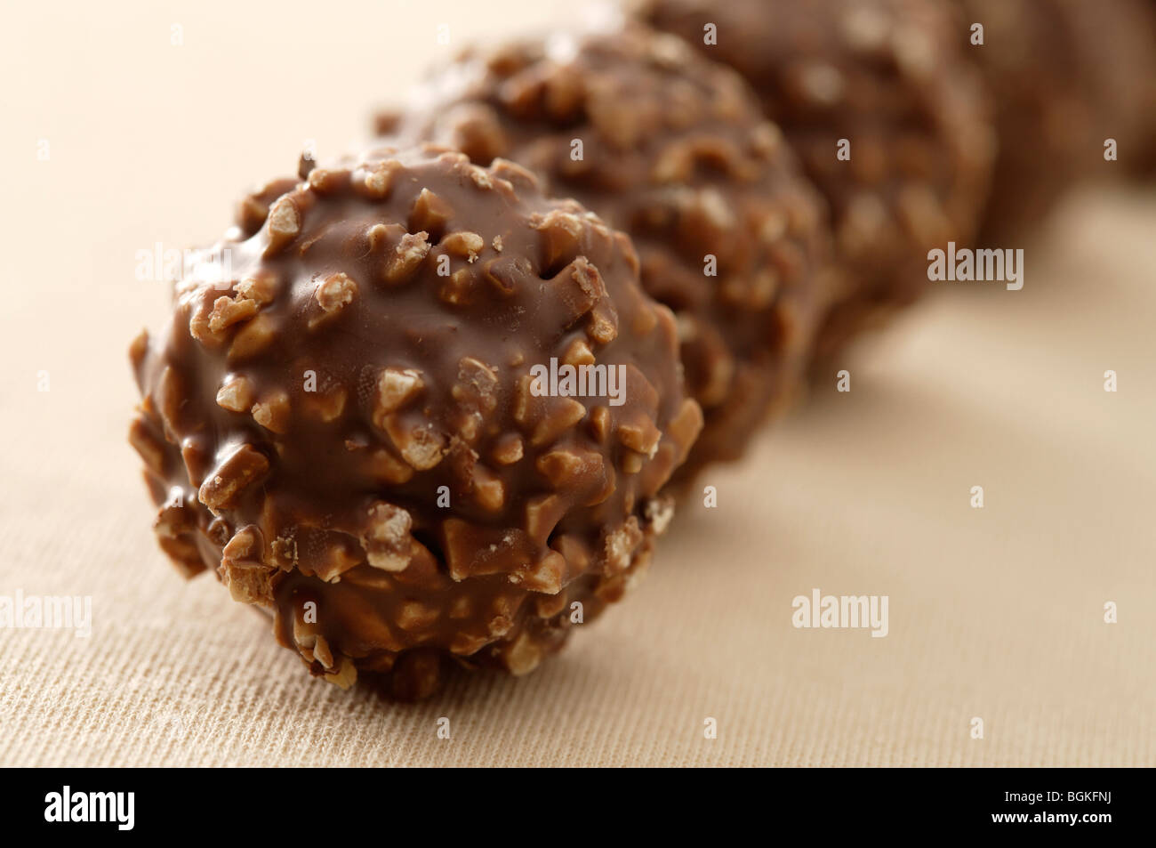 Rough round chocolates Stock Photo - Alamy