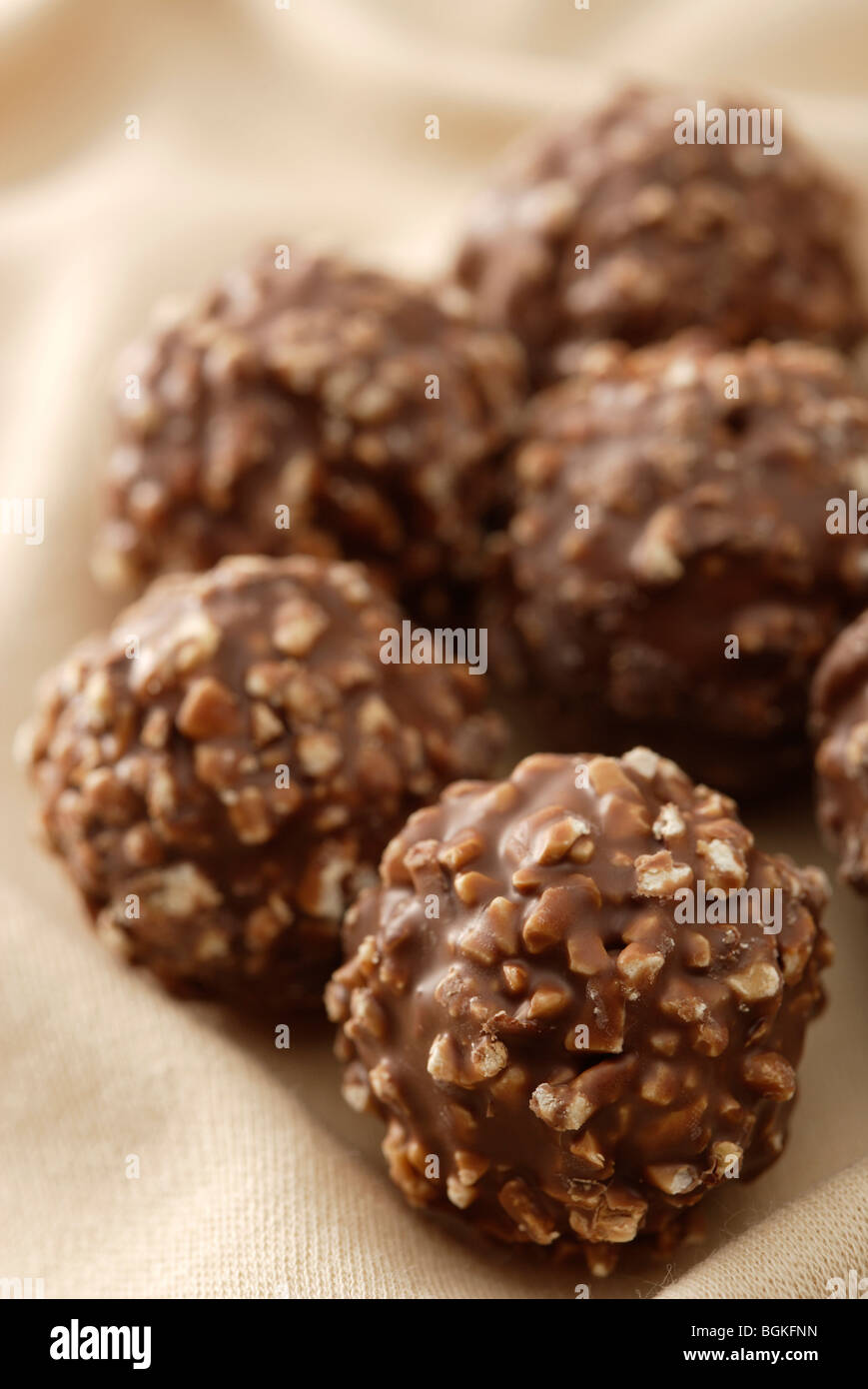 Rough round chocolates Stock Photo - Alamy