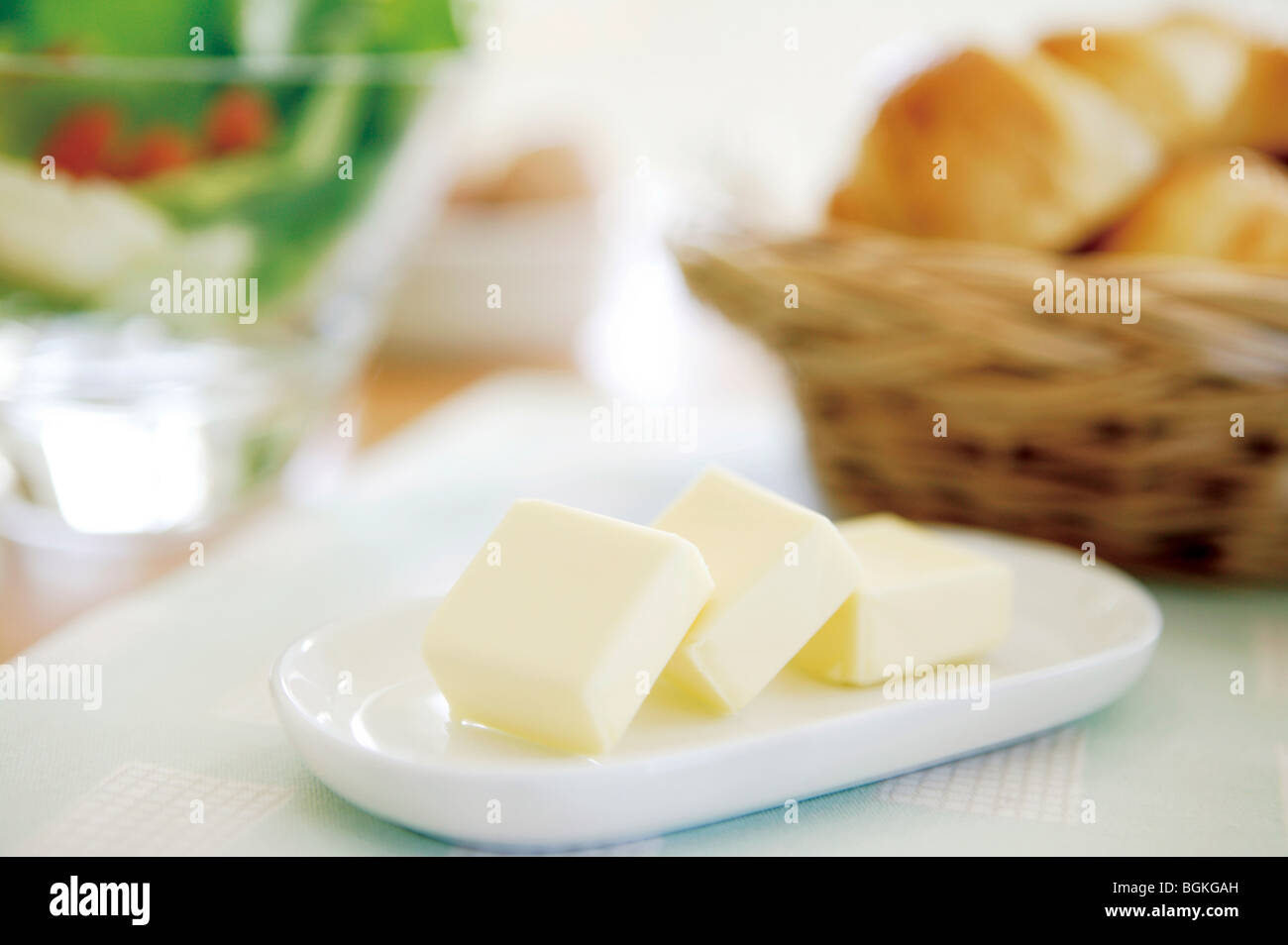 Sliced butter on plate Stock Photo - Alamy