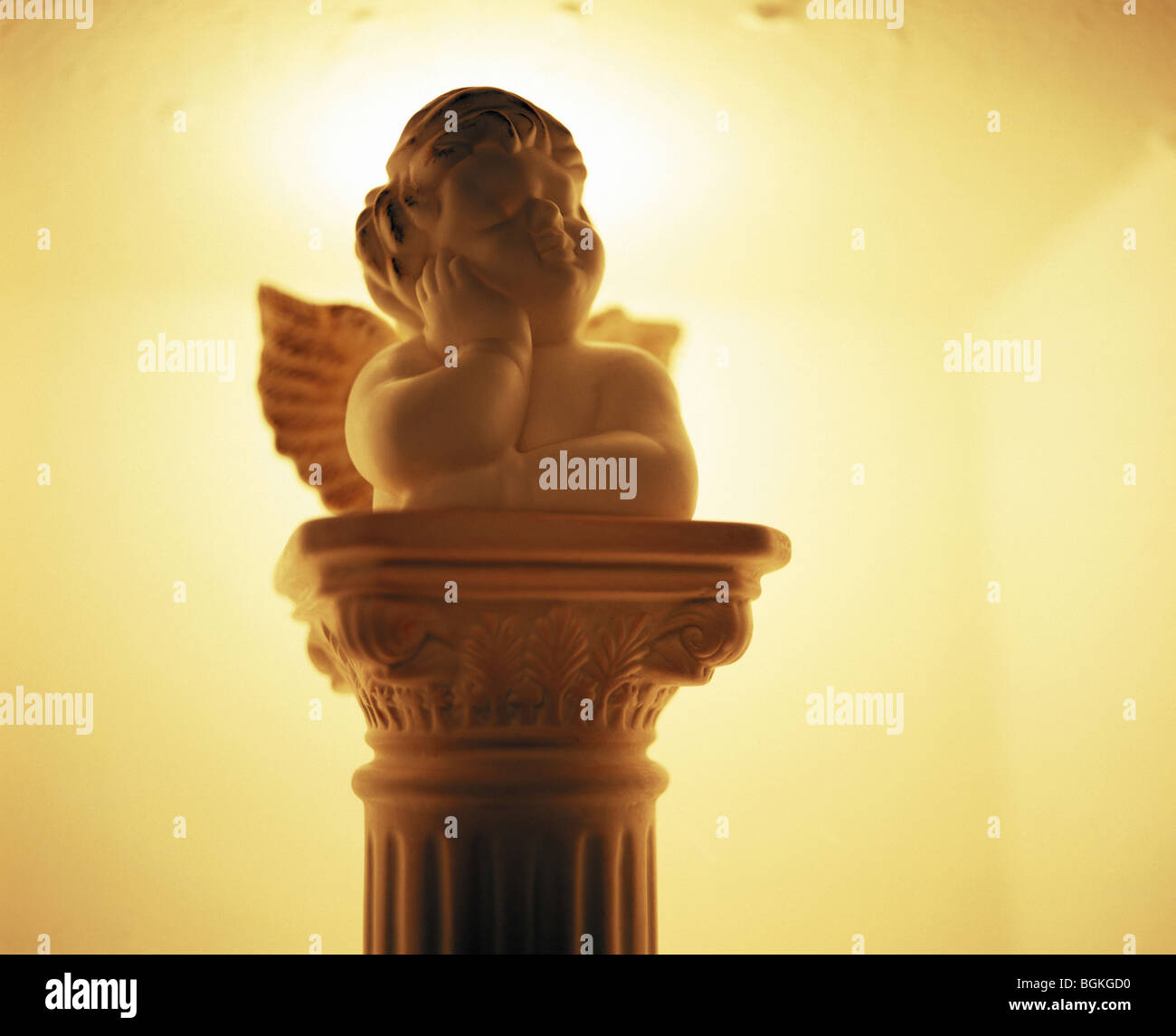 Statue of angel colored background Stock Photo - Alamy