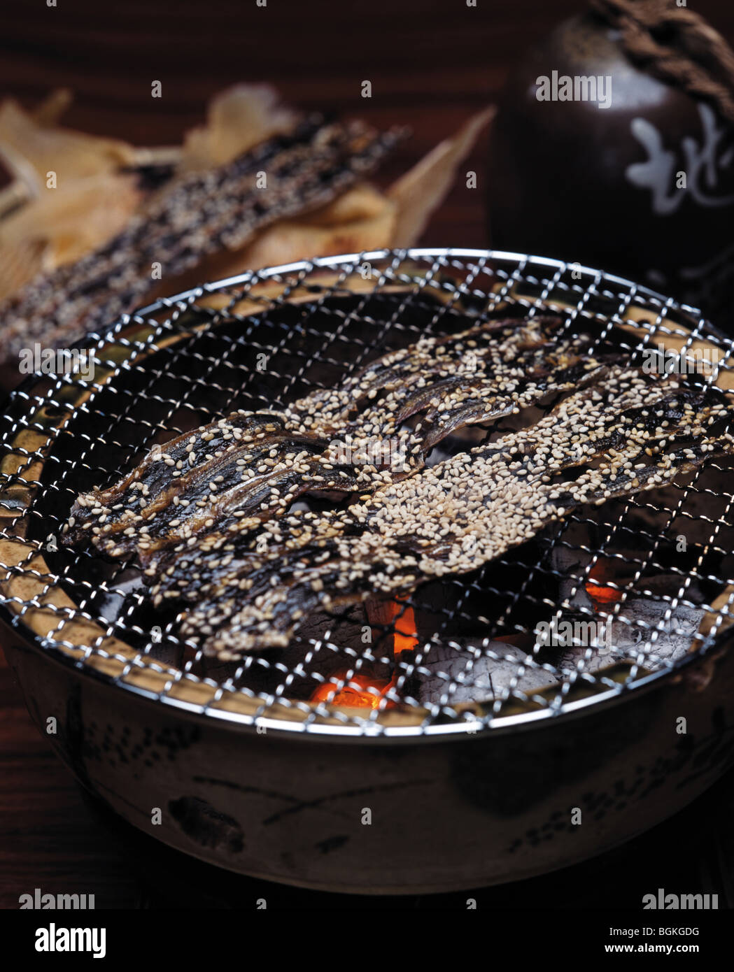 Slices of dried fish on grill Stock Photo - Alamy