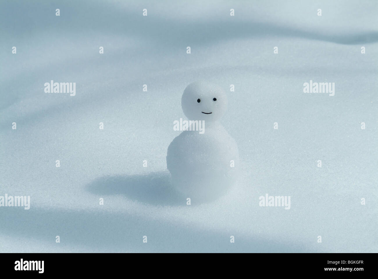Snowman on snowy land white background Stock Photo - Alamy
