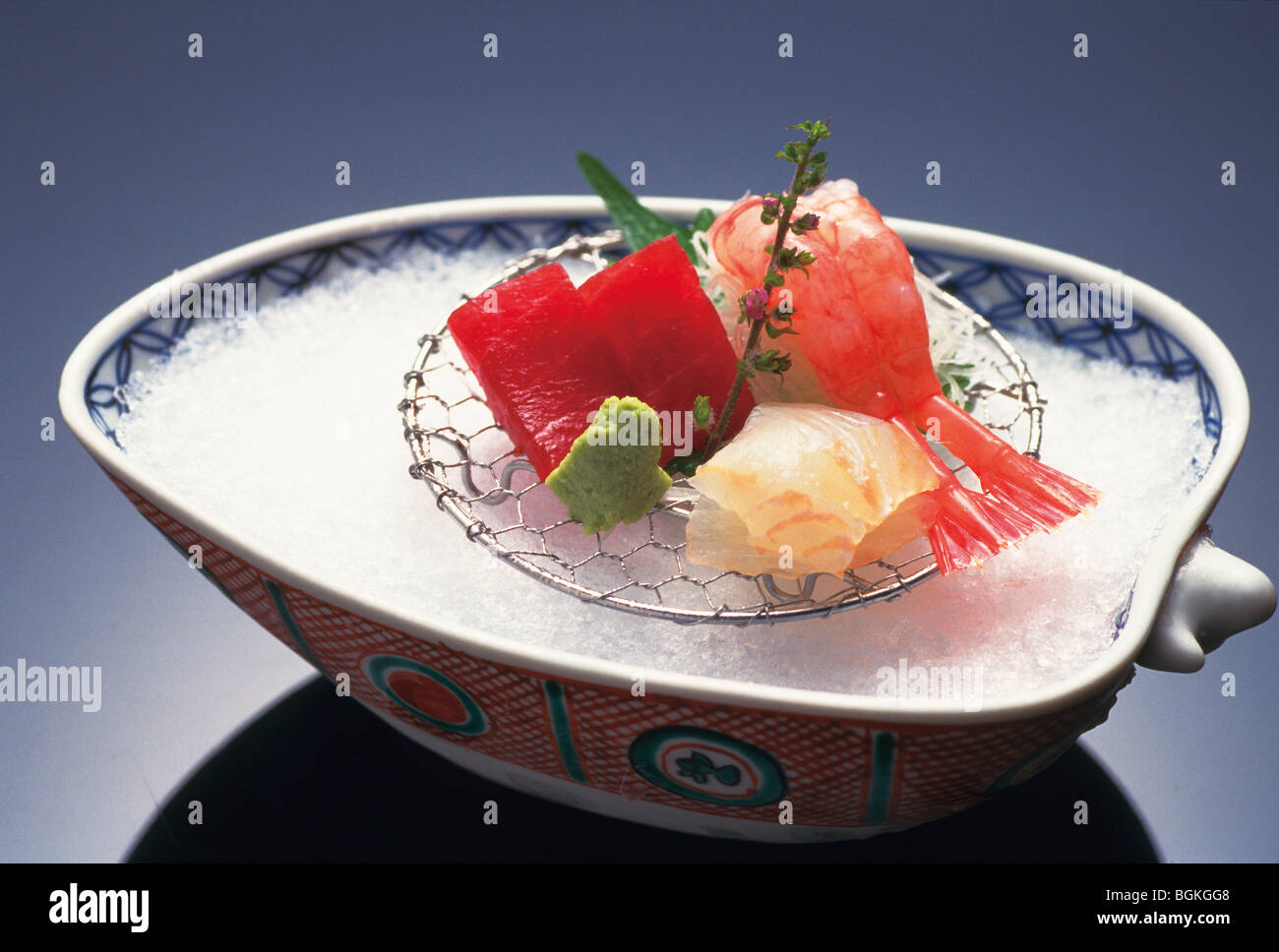Slices of raw fish on crushed ice black background Stock Photo - Alamy