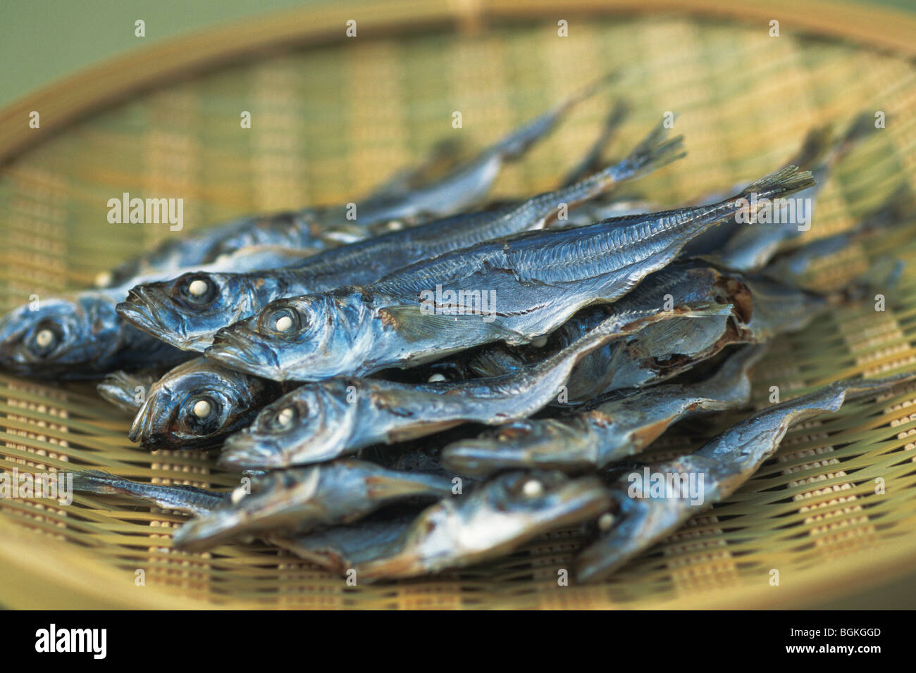 Dried fish on colander close up Stock Photo - Alamy