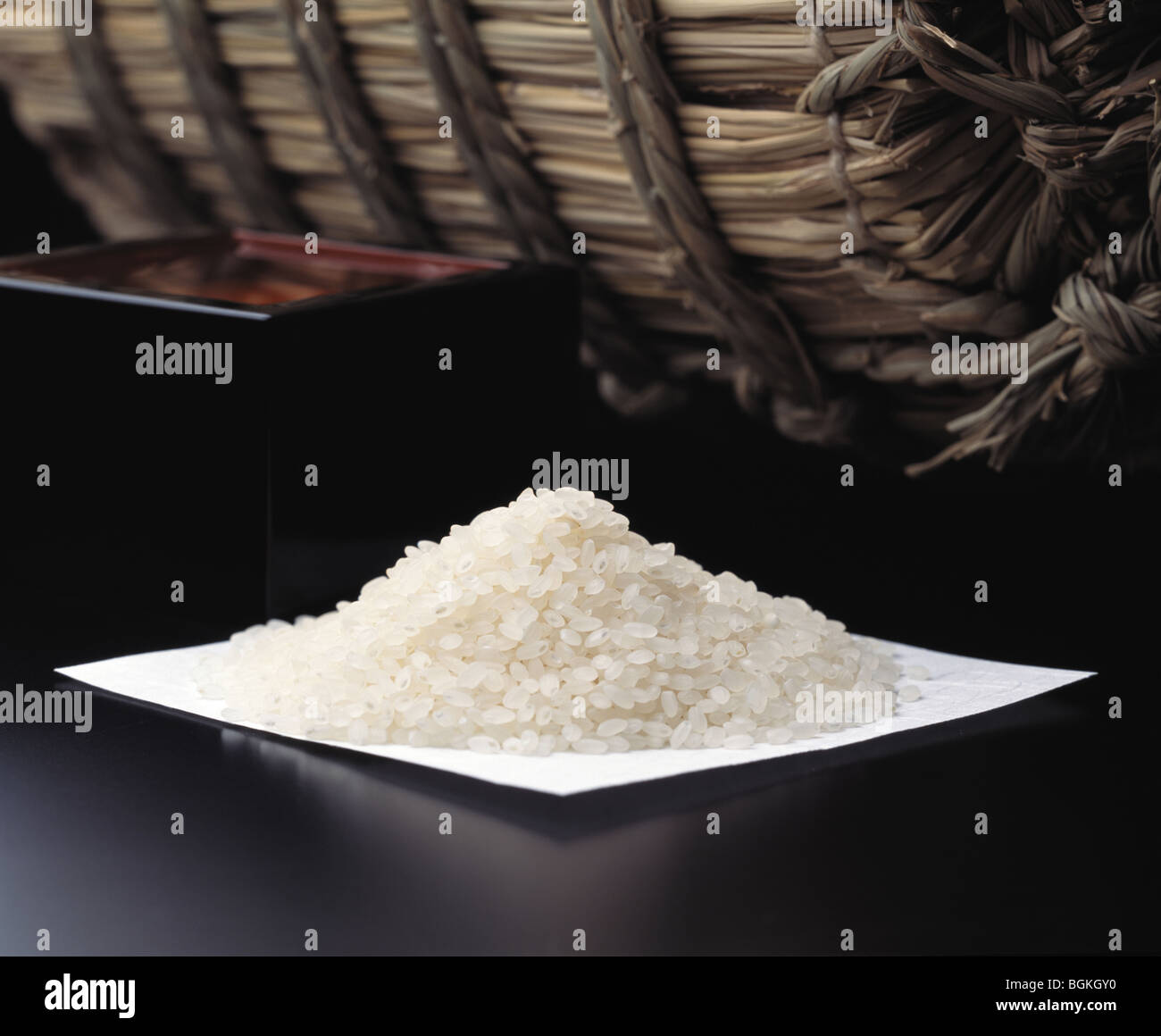 Heap of rice black background Stock Photo - Alamy