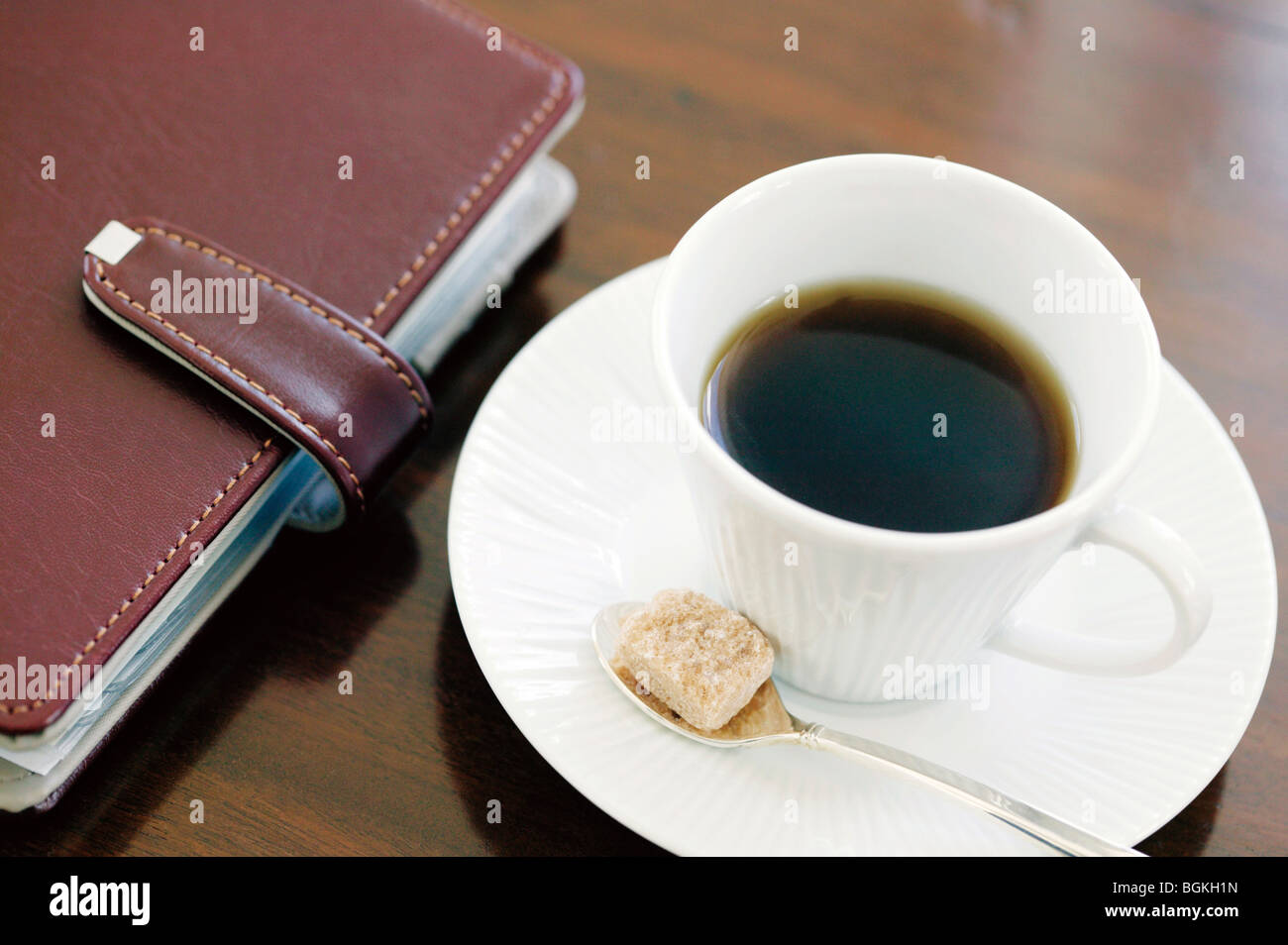 Personal organizer and cup of coffee Stock Photo - Alamy